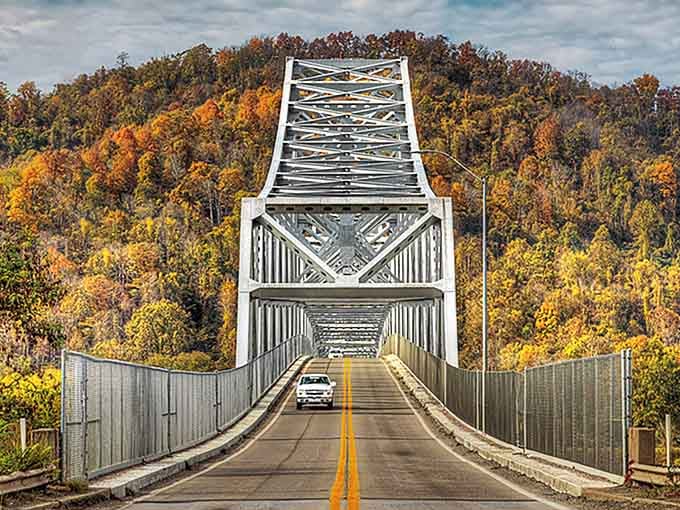 This steel bridge framed by autumn colors looks like a postcard you'd actually want to send to someone.