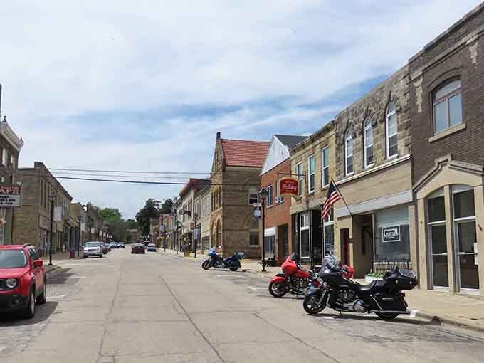 Stone buildings and motorcycles line these streets where Cornish miners once walked to work each morning.