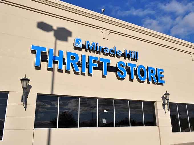 The bright blue lettering practically sings "miracles happen here" under that perfect Carolina sky.