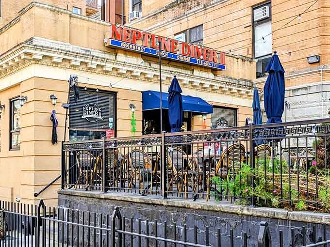Neptune Diner II's classic signage promises the holy trinity of diner perfection: breakfast, lunch, and dinner. The outdoor seating area waits patiently for hungry Brooklynites.