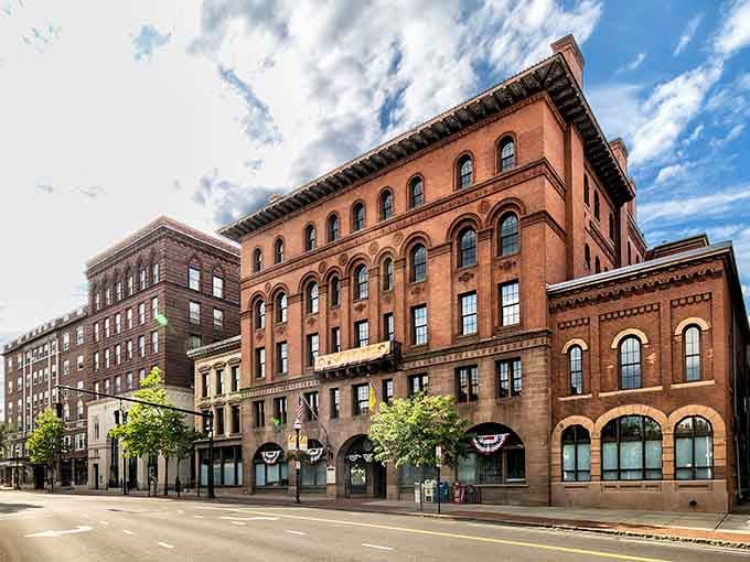 These magnificent brick buildings stand proud like something from a classic movie set, beautifully preserved and absolutely stunning.