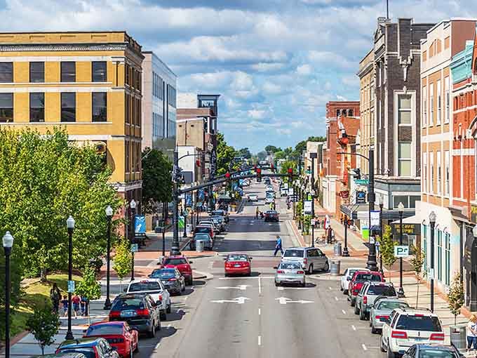 Downtown Owensboro stretches toward the horizon, where colorful facades promise community charm without the big-city price tag.