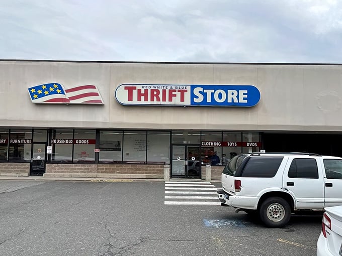 The patriotic flag logo waves proudly above this sprawling thrift wonderland that stretches wider than your shopping list.