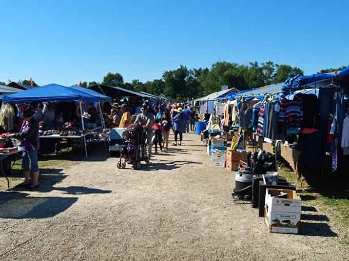 Blue canopies dot the landscape like a cheerful village of bargain hunters and treasure seekers.