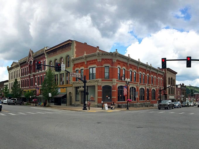 This corner building commands attention like the town's anchor, solid and beautiful with its red brick and arched windows.