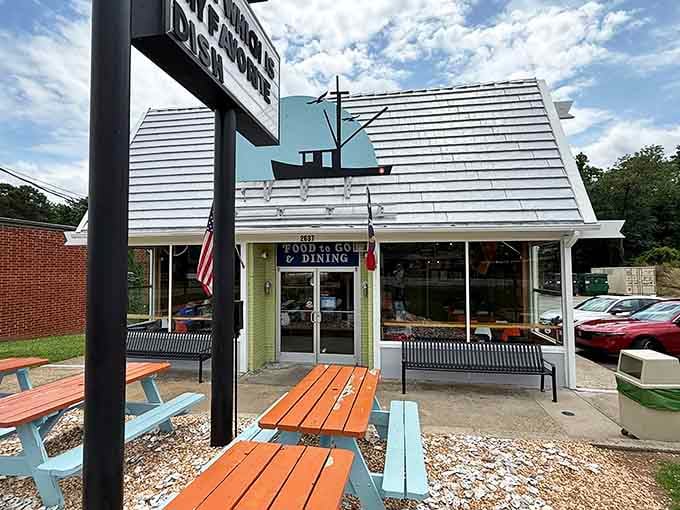 The bright blue picnic tables outside signal one thing: this is where casual meets delicious in the best way.