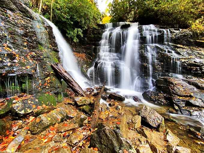 Autumn leaves carpet the rocks while multiple streams dance down the cliff in perfect harmony together.