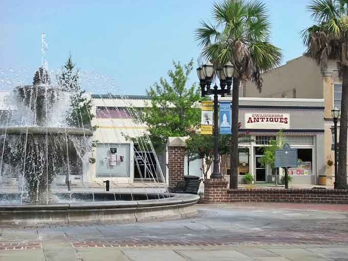 The fountain dances in Swainsboro's square while palm trees sway, creating a scene straight from a vintage postcard collection.