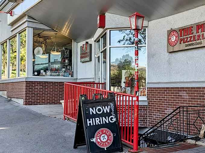 Down these red stairs lies pizza paradise, where underground dining feels like discovering a delicious secret speakeasy.