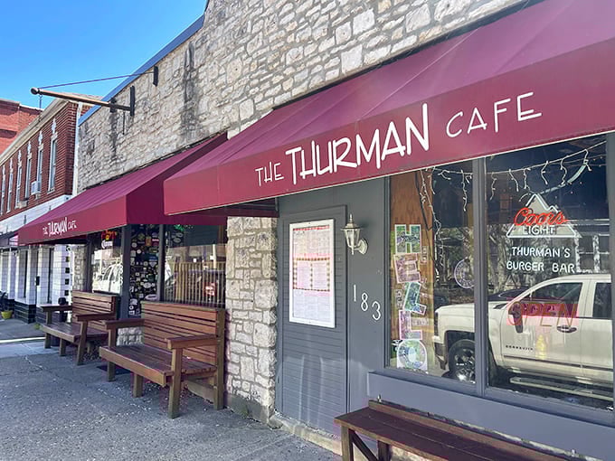That bold red awning has been beckoning hungry folks for decades, promising burgers that defy gravity and logic.