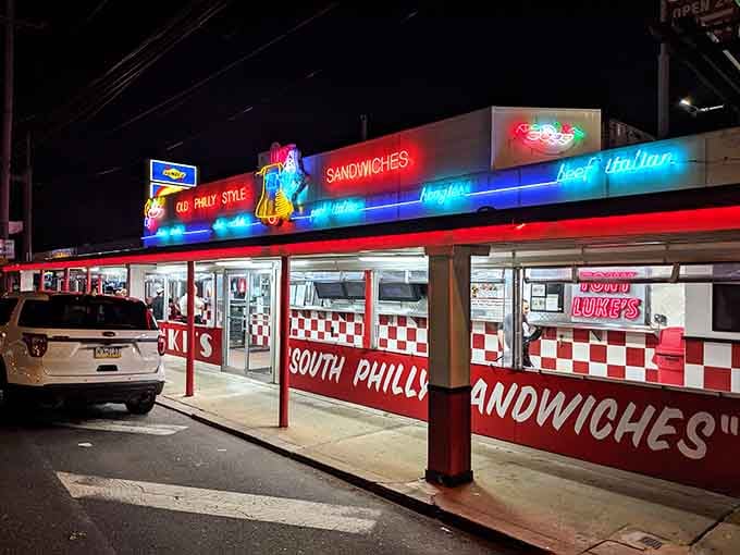 Those neon lights glowing against the evening sky are like a beacon calling hungry souls to cheesesteak paradise.