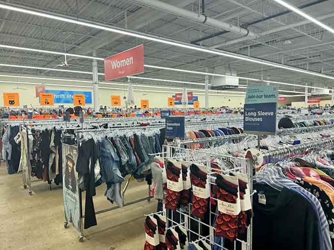 Organized racks of women's clothing stretch toward the horizon, proving that thrift shopping doesn't have to mean chaos.