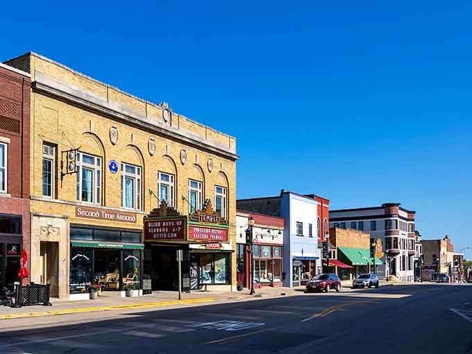 Classic storefronts stand shoulder to shoulder under that brilliant blue sky, each one telling its own story.