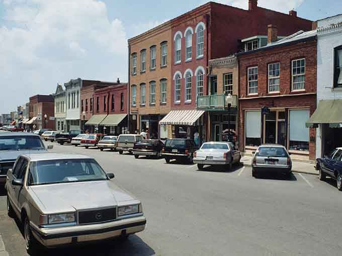 Rainbow-colored storefronts line this street where every building tells a story older than your favorite vinyl records.
