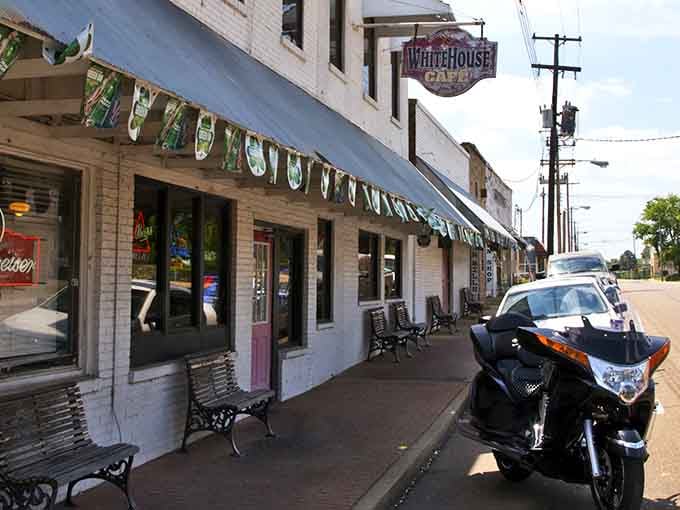 The White House Cafe's vintage storefront whispers of simpler times. This isn't just a meal stop—it's a time machine with really good pie.