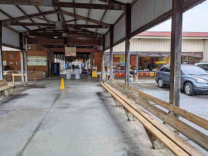 Those long wooden benches line the covered walkways, ready to hold your finds while you explore even more booths.