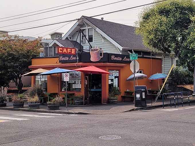 That cozy umbrellas and corner location create the perfect neighborhood breakfast nook where everyone feels like family.
