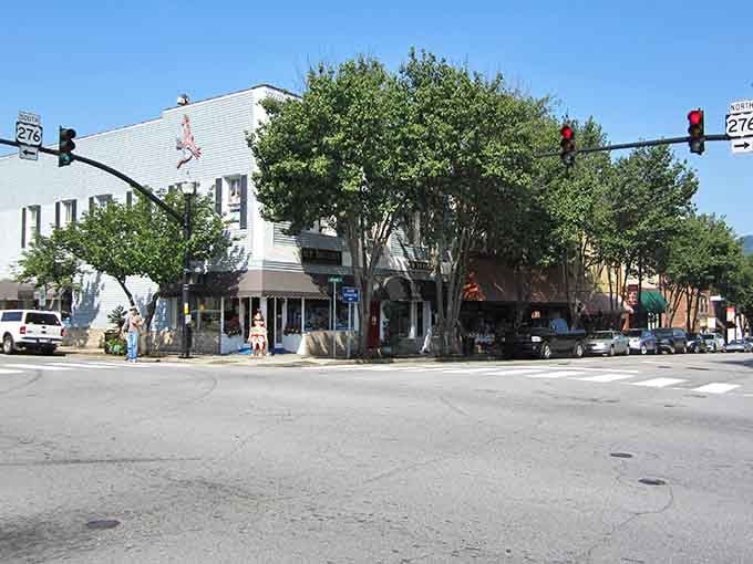 Mature trees shade this downtown intersection where pedestrians still outnumber the cars most days.