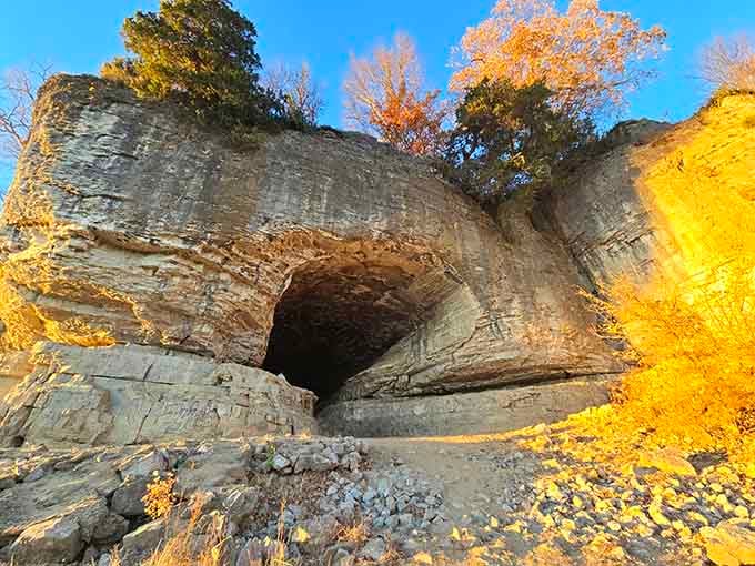 Golden autumn light painting the cave walls transforms ordinary rock into something straight out of an adventure movie.