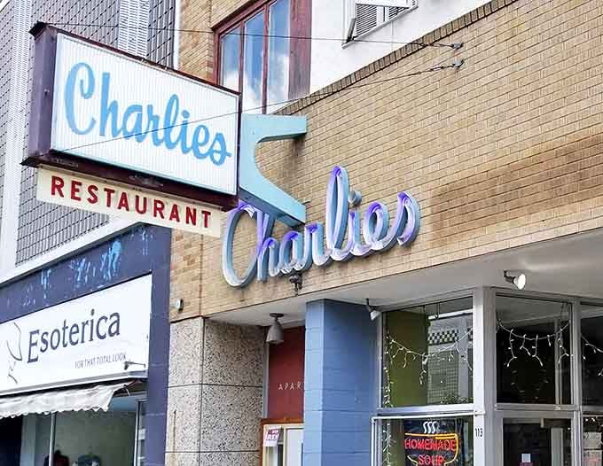 The vintage script lettering on Charlie's storefront whispers promises of comfort food done right every time.