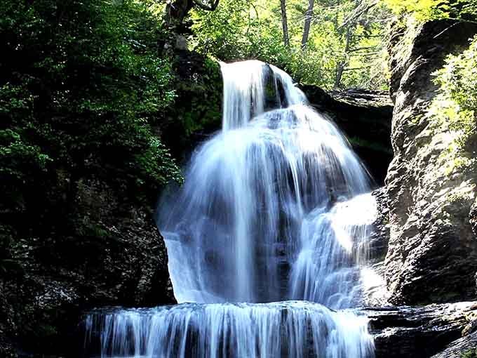 This towering beauty flows like a silk ribbon against ancient stone, proving Pennsylvania's got serious waterfall game.