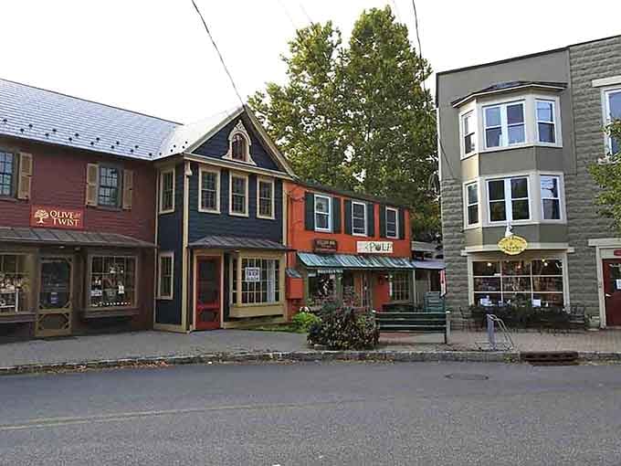 Colorful storefronts line up like a box of crayons, each building adding its own personality to the riverside scene.
