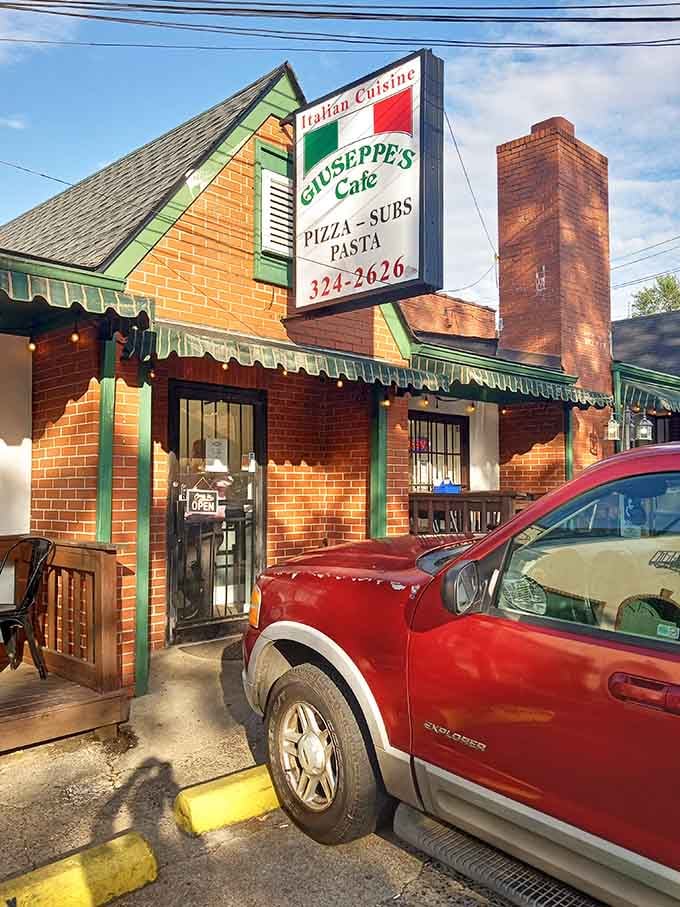 Sunlight catches Giuseppe's charming green awnings, promising authentic Italian goodness that would make your nonna weep with joy.
