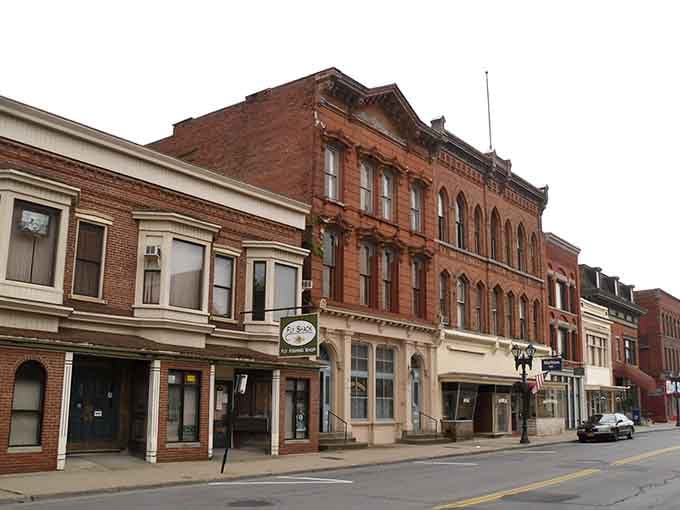 Red brick buildings line these quiet streets where your neighbors still remember when handshakes meant something important.