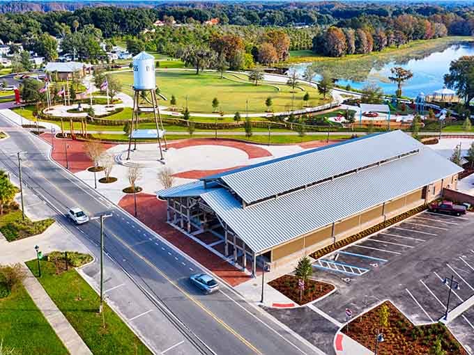 Modern pavilion meets small-town charm with a water tower backdrop that screams authentic Florida living without the fuss.