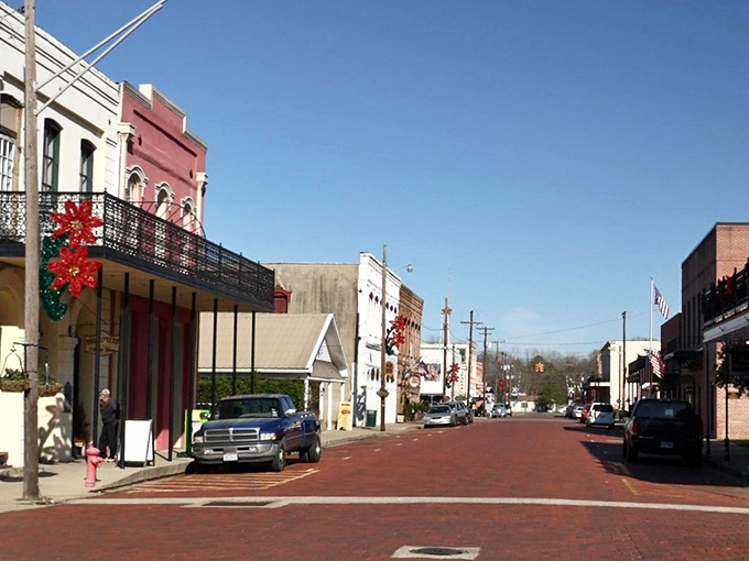 Wrought-iron balconies and cheerful wreaths blend perfectly, showing how history and celebration make wonderful neighbors in Jefferson.