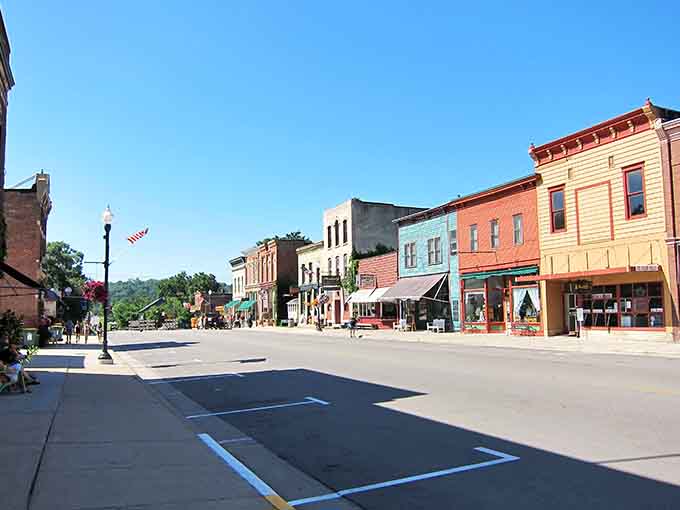 Painted storefronts in cheerful colors line streets so calm you could nap in the crosswalk safely.