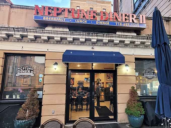 Step through these doors at Neptune Diner II and enter a world where coffee cups are always full and the menu is thicker than most novels.