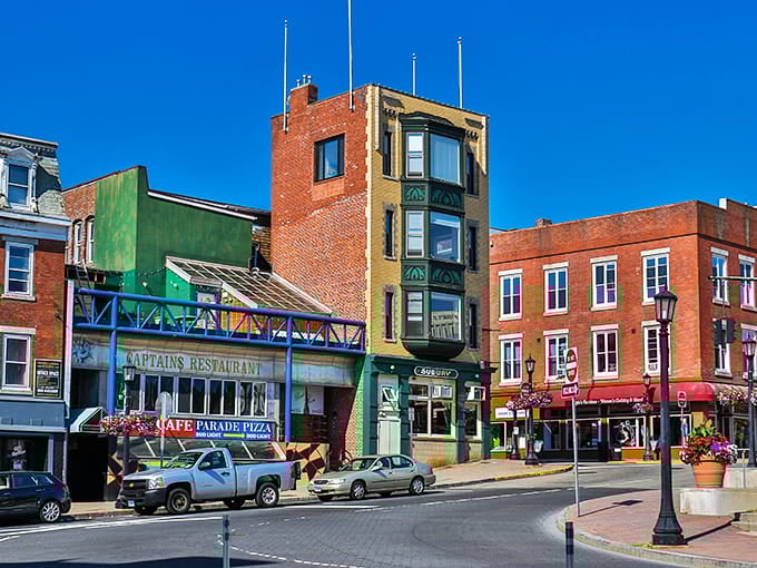 That narrow yellow building stands like a sentinel, proving character matters more than square footage in downtown.