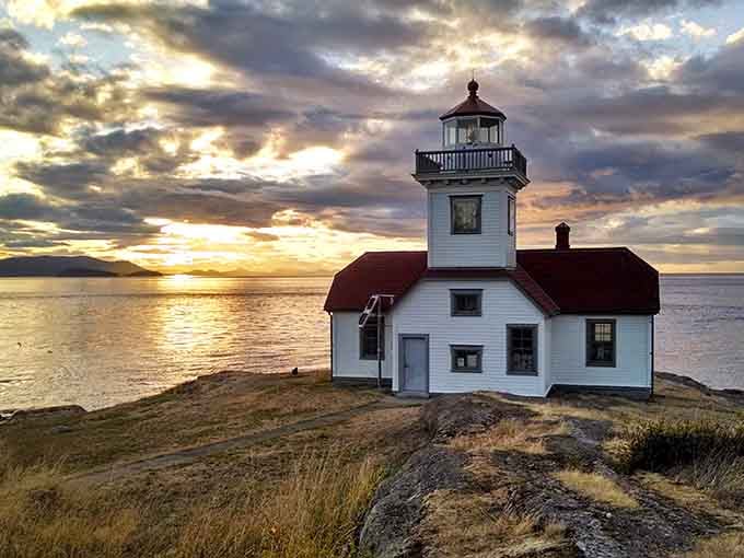 When the lighthouse catches that golden hour glow, even the clouds stop to admire the view.