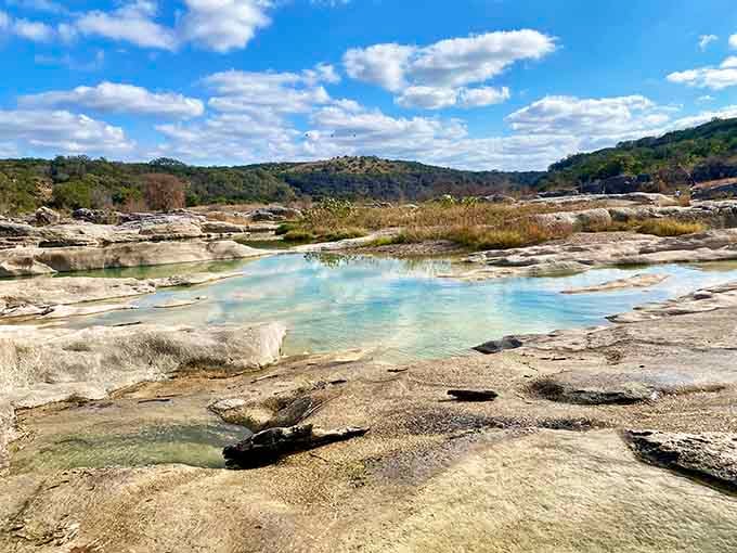 These crystal-clear pools nestled in ancient rock look like something from a travel magazine's tropical issue.