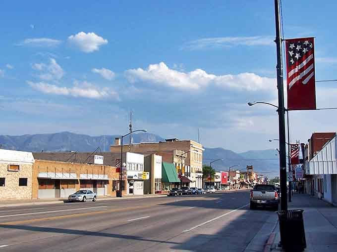 Main Street stretches toward distant mountains, offering that rare combination of community charm and budget-friendly living.