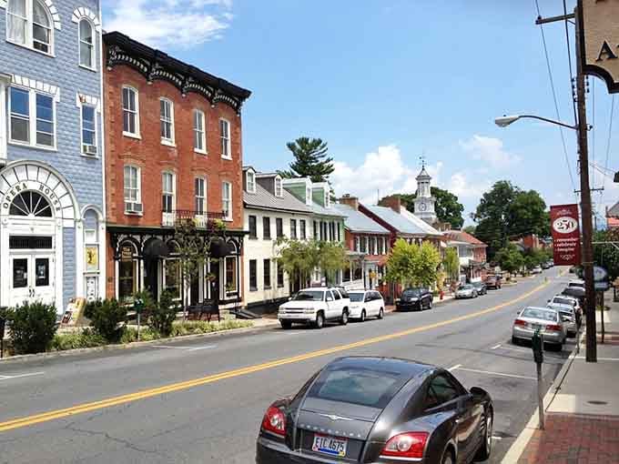 Morning light bathes Shepherdstown's historic street, where colonial architecture meets small-town charm under an autumn sky.
