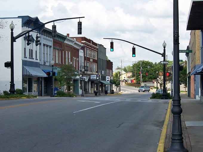 Empty streets reveal Somerset's quiet charm, where traffic lights sway gently above peaceful intersections. 