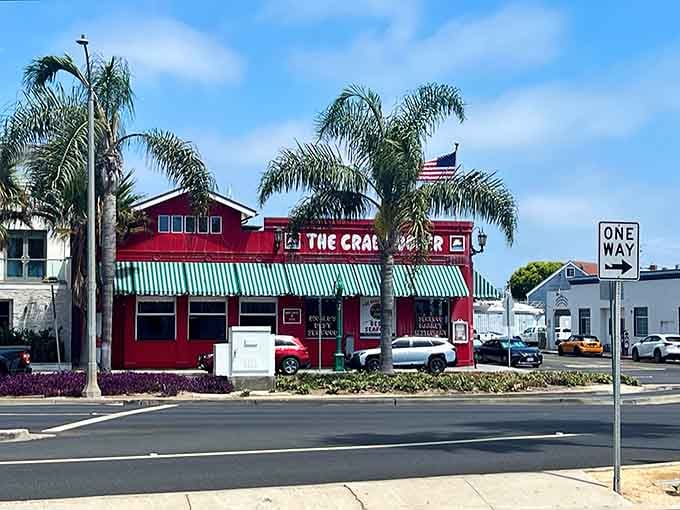 Red as a lobster's blush! The Crab Cooker's iconic building stands out like a cardinal in a penguin convention.