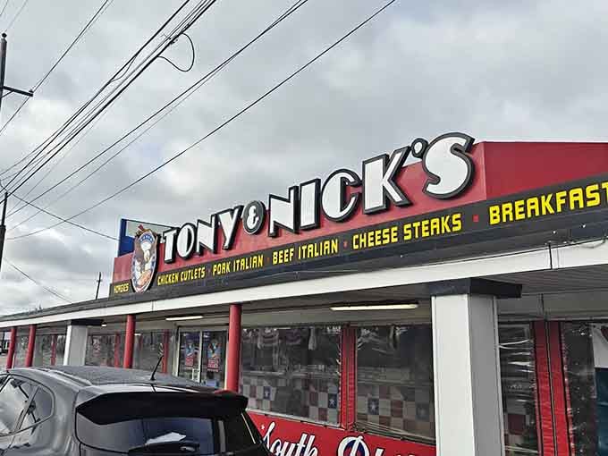 The red and white checkerboard pattern says "classic diner," but the crowd says "destination worth finding."