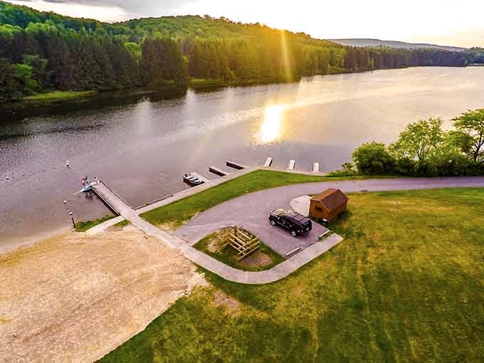Golden hour light dances across the lake where fishing docks wait patiently for the next big catch.