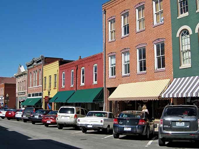 Those cheerful awnings and painted facades make window shopping feel like strolling through a living history book.