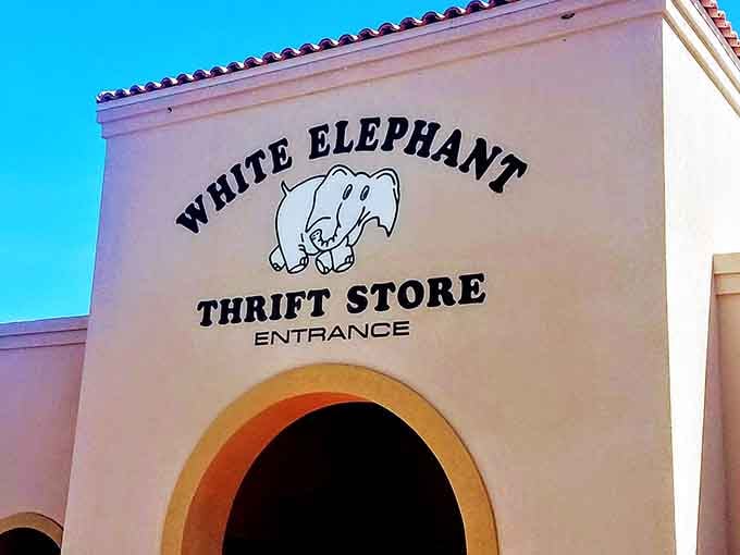 That cheerful elephant logo beckons shoppers through an archway that feels almost ceremonial for secondhand shopping.