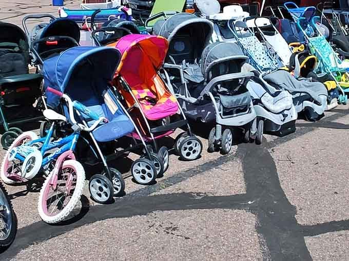 Rows of strollers and bikes await new families, proving one person's outgrown gear becomes another's perfect budget-friendly solution.