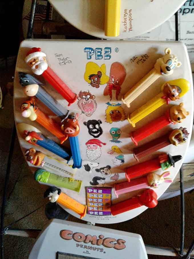 PEZ dispensers never looked so dignified, arranged like tiny sentinels guarding their ceramic canvas home.