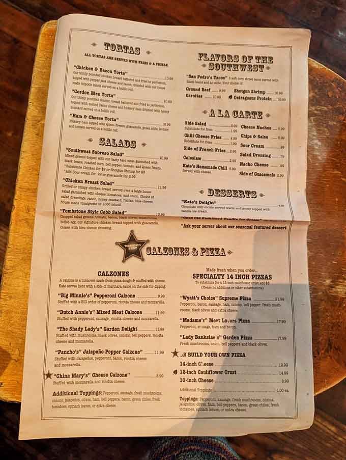 The menu reads like a Wild West fever dream, with calzones named after outlaws and pizzas honoring legendary ladies.