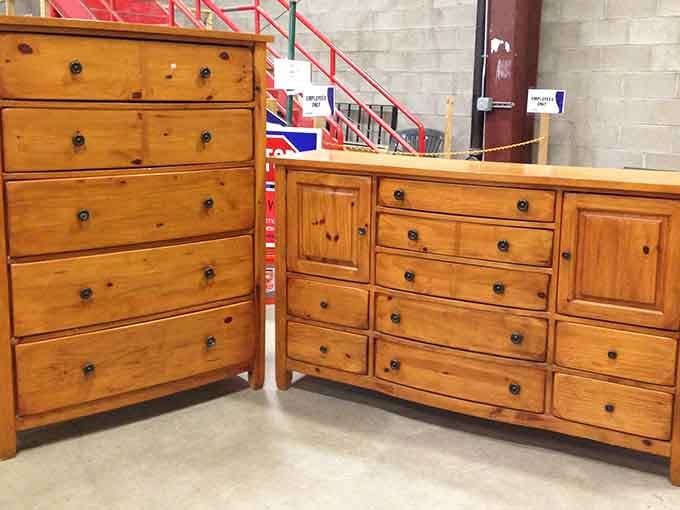 Solid pine dressers standing at attention, ready for their second act in someone's bedroom. Craftsmanship that puts modern furniture to shame.