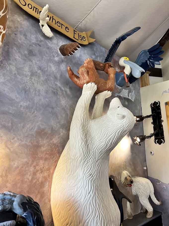 A polar bear reaches skyward with friends, proving that carousel animals don't need gravity to tell their stories.