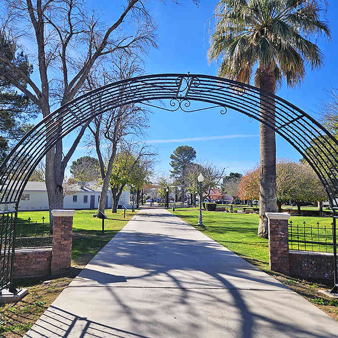 Church Square's elegant archway invites visitors to stroll through a peaceful oasis where desert heat takes a polite step back.