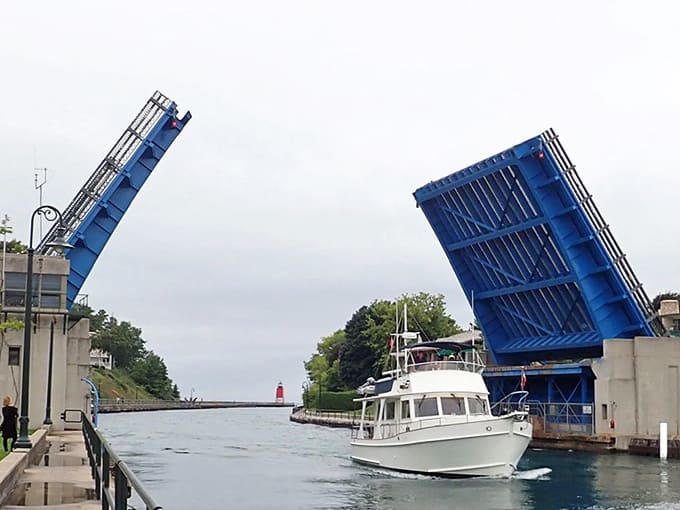 Watch the drawbridge lift and you'll understand why locals never tire of this daily mechanical ballet connecting the lakes.